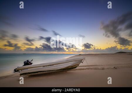 Small dingy or tinny with outboard motor on the water Stock Photo - Alamy