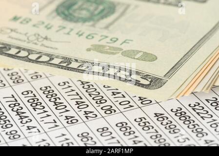 Dollar bills and a spreadsheet Stock Photo - Alamy