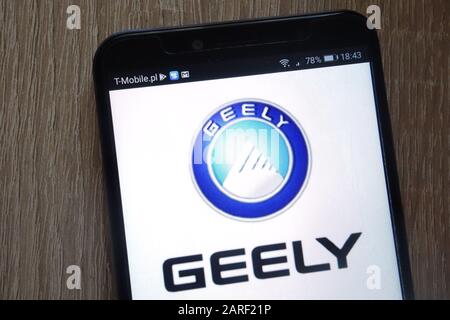 Geely logo is displayed on smartphone. Zhejiang Geely Holding Group Co ...