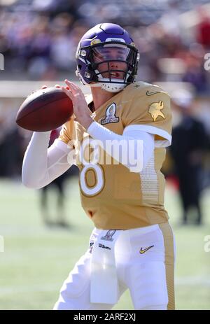 Minnesota Vikings quarterback Kirk Cousins, right, chats while arming ...