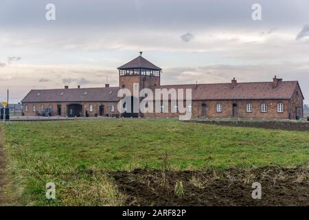 Poland, Brzezinka, Auschwitz II - Birkenau. The entrance gate at ...