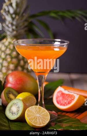 Glass of tropical exotic multifruit juice and fruits at the pier ...