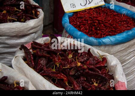 Bag of dried red peppers on a street market stall, Egypt Stock Photo ...