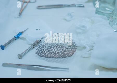 Skull clamp with pins and antiseptic solution for head fixation in ...