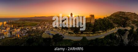 Aerial sunset panorama view of Cullera castle and popular seaside ...