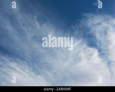 Beautiful cloudscape, breathtaking white clouds in blue sky over valley ...