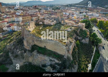 Aerial panoramic view of medieval Elda castle above the town with ...