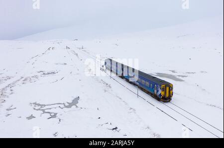 A Scotrail train travels through heavy snow at Corrour on route from ...