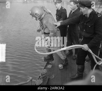 Diver De Jong jumps into the sea at the site of the sunken Faustus ...