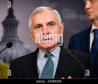 U.S. Senator Jack Reed (D-RI) speaking with U.S. Senator Tim Kaine (D ...