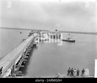 Cargo ships, oil tankers and bulk carriers anchored offshore along the ...