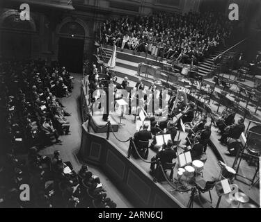 Conductor with baton in concert hall, closeup Stock Photo - Alamy