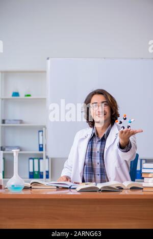 The chemistry lecturer during lecture in college Stock Photo - Alamy