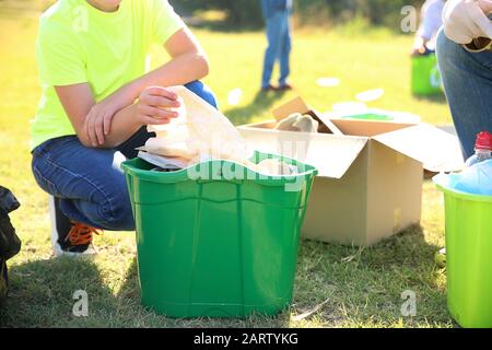 People gathering garbage outdoors. Concept of recycling Stock Photo - Alamy