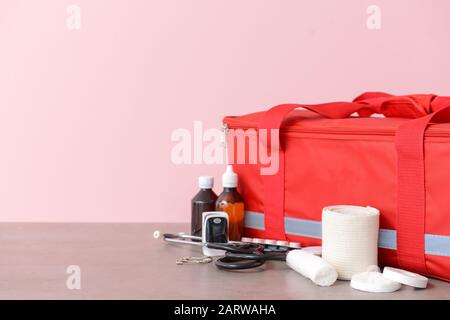 First aid kit on table in clinic Stock Photo - Alamy