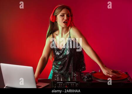 Female dj playing music in nightclub. Poster for World DJ Day Stock ...