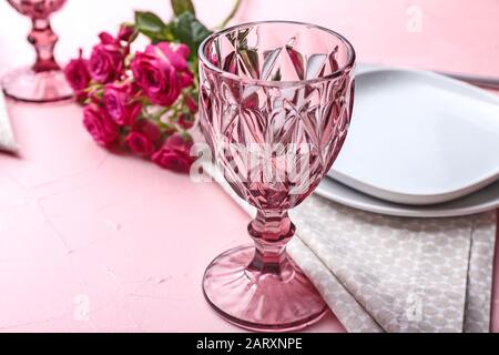 Beautiful table setting on color background Stock Photo - Alamy