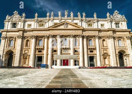The beautiful facade of St. Peter's Basilica with bustling traffic ...