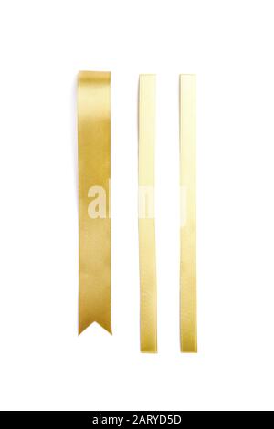 Blank paper sheet with beautiful golden ribbon on white background ...