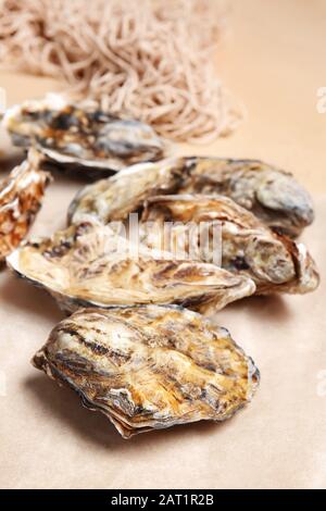 Tasty oysters on color background Stock Photo - Alamy