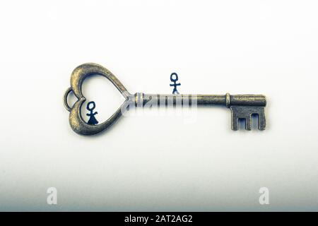 Tiny stick man and heart shaped key on white Stock Photo - Alamy