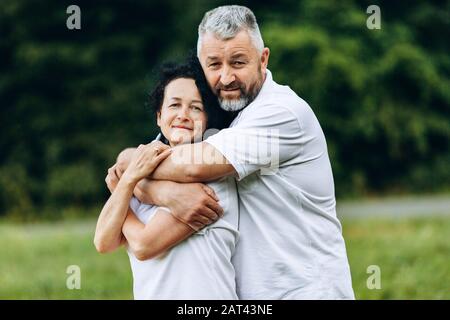 Middle age man and woman wearing doctor uniform having medical ...