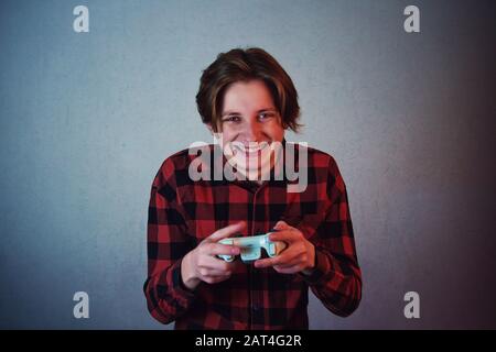 Gamer nerd playing video games on television Stock Photo - Alamy