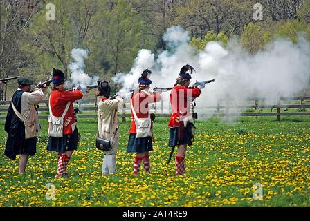 A group of soldiers with guns on a field Stock Photo - Alamy