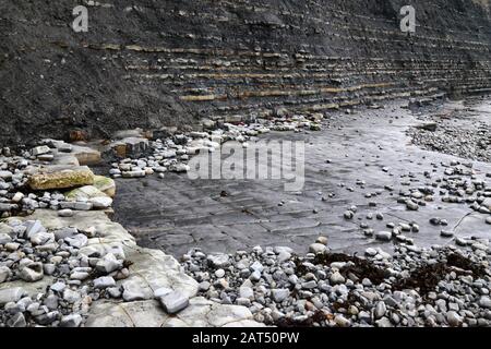Limestone and shale rock formations on the shore at Kilve, Somerset ...