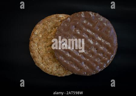 An eclipse of two chocolate oaty biscuits Stock Photo - Alamy