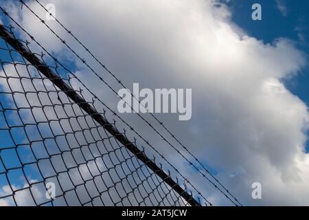 blocked off area with barbed wire fence Stock Photo - Alamy