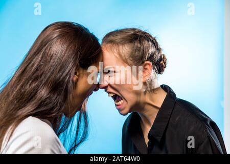 Two Women Screaming at Each Other Face to Face Stock Photo - Alamy