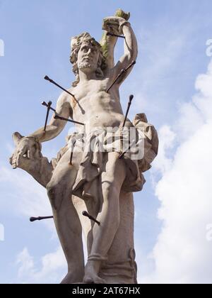 Stone sculpture of Saint Sebastian with arrow holes in the cathedral ...