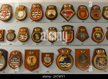 Display of many badges of Royal Navy ships at Nothe Fort museum ...