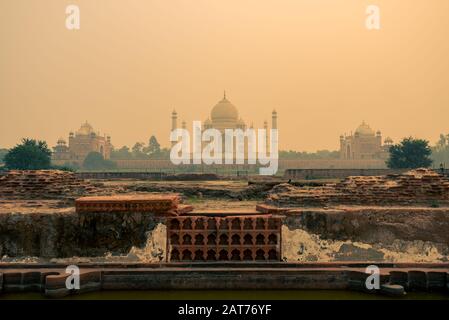 Wide shot of the backside of the Taj Mahal in Agra, India on overcast ...