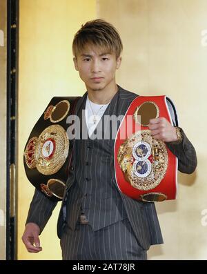 Naoya Inoue (C) attends a press conference with his trainer and father ...
