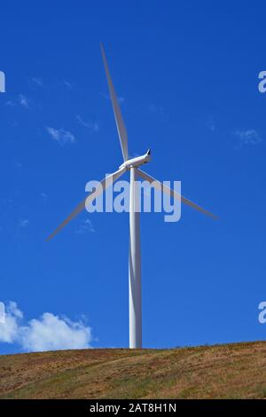 single wind turbine on the hill produces green clean energy Stock Photo ...