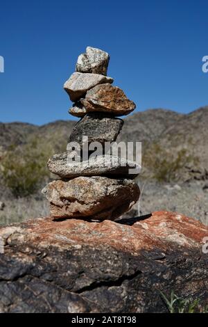 A stack of rocks known as a cairn marks the path for hikers Stock Photo ...