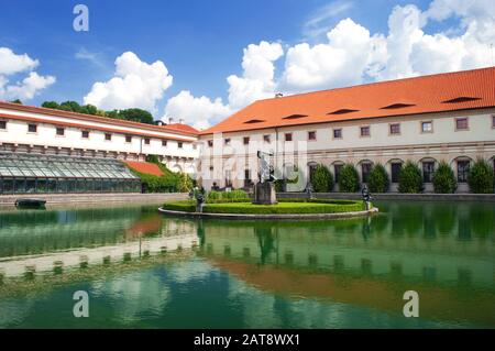 Red tiled roof. CLouds in blue sky. Green tree Stock Photo - Alamy
