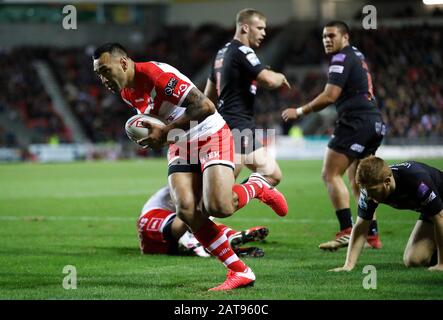 St Helens Zeb Taia goes over for a try past Salford Red Devils' Ben ...