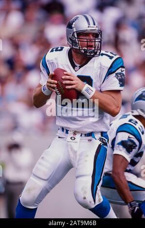 Carolina Panthers quarterback Kerry Collins (12) scrambles under ...