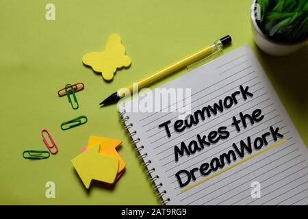 Teamwork Makes the Dreamwork Sign on white paper. Man Hand Holding ...