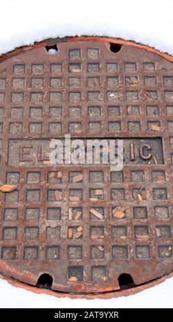 Close up an electrical manhole cover Stock Photo - Alamy