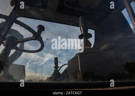 excavator cockpit, Cabin of an old excavator in a construction site ...