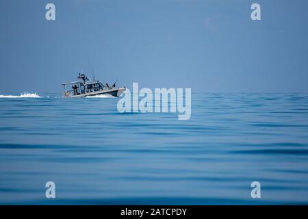 A SeaArk 34-foot Dauntless patrol boat provides security for a U.S ...