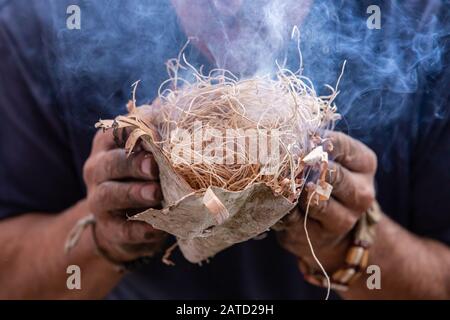 How to start a fire the traditional way: a man demonstrates ancient ...