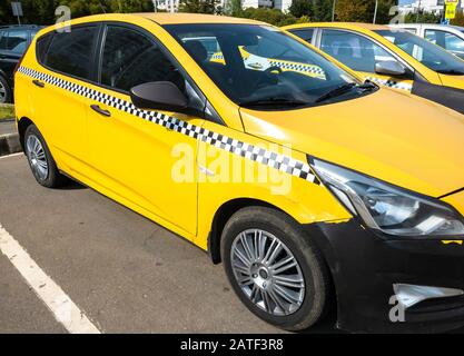 Taxi without brand on the street in front of houses in Moscow, Russia ...