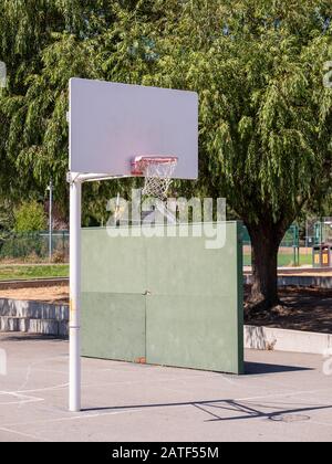 Basketball hoop at a grade school playground Stock Photo - Alamy