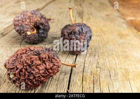 Shriveled apple. Old apple. Wrinkled apple texture. Dry skin. Old ...