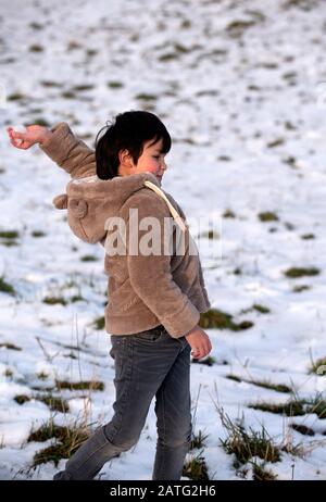 Child throwing snowball Stock Photo - Alamy